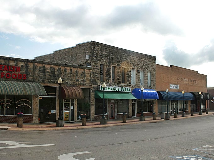 Classic storefronts line the street like old friends catching up, each one telling stories of simpler times.