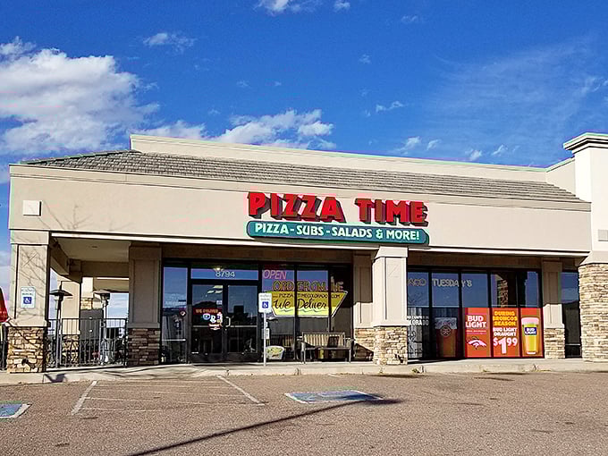 That cheerful red and green sign promises comfort food magic waiting just beyond those glass doors.