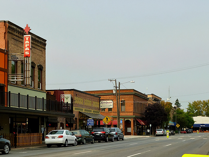 Historic brick buildings line Sandpoint's main street, where local shops invite you to slow down and stay awhile.