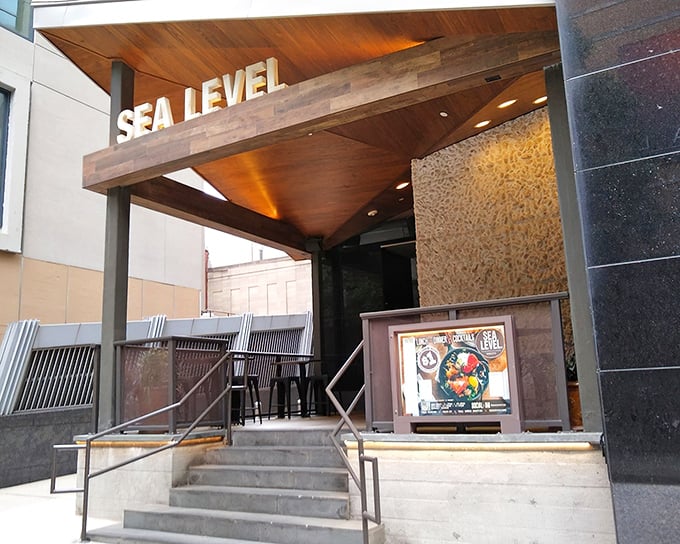 Modern meets maritime at Sea Level's stylish entrance – like finding a coastal escape hidden in uptown Charlotte.
