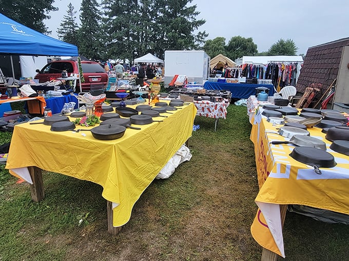 Bright yellow tablecloths transform ordinary cast iron into extraordinary discoveries—this is bargain hunting at its finest, folks.