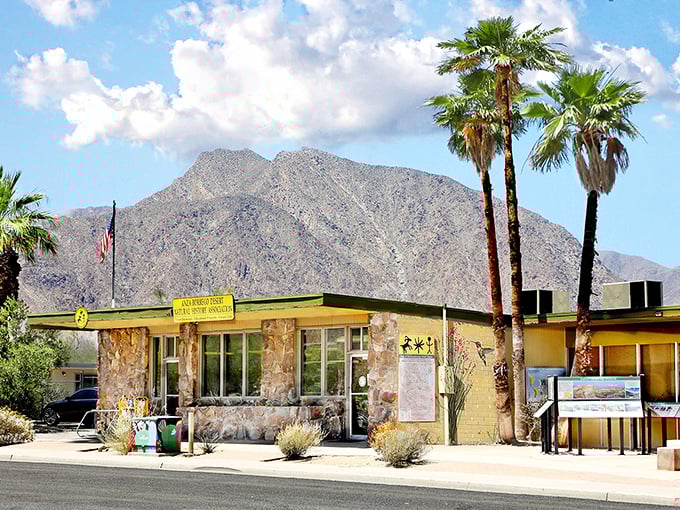 This stone visitor center looks like it was carved from the mountains behind it – desert architecture at its most harmonious.