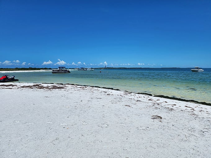 Beach day perfection formula: powdery white sand + crystal clear waters + boats bobbing offshore = why Floridians never need vacation days.