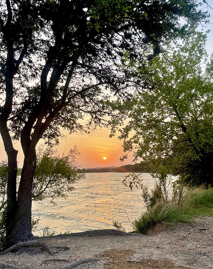 Mother Nature showing off at Boerne City Lake Park, where Texas sunsets transform ordinary afternoons into postcards you'll want to mail to everyone you know.