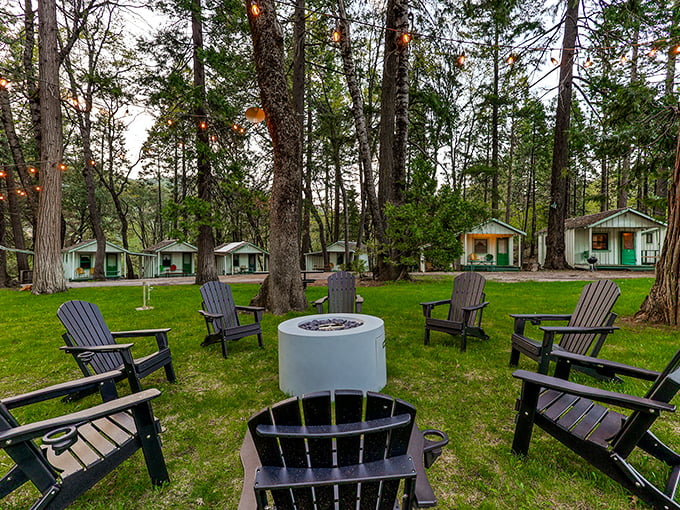 Adirondack chairs circle a fire pit at Cave Springs Resort, where conversations flow as freely as the nearby Sacramento River. Nature's living room awaits.