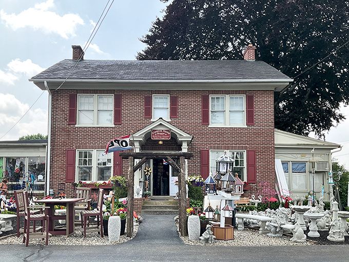This charming brick shop isn't just selling goods—it's offering a masterclass in porch decor that would make Martha Stewart take notes.