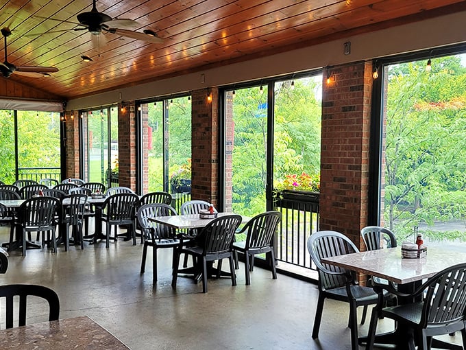 Sunlight streams through the screened porch dining area, creating the perfect backdrop for comfort food conversations and German potato salad revelations.