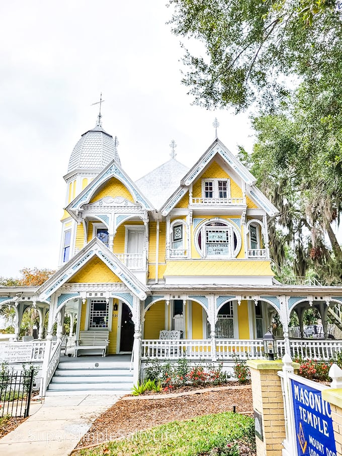 This sunshine-yellow Victorian masterpiece isn't compensating for Florida's lack of seasons—it's the Donnelly House, Mount Dora's most photographed building and architectural eye candy.