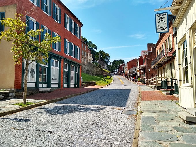 High Street winds through town like a time-traveling pathway, where modern visitors stroll the same cobblestones as figures from history textbooks.