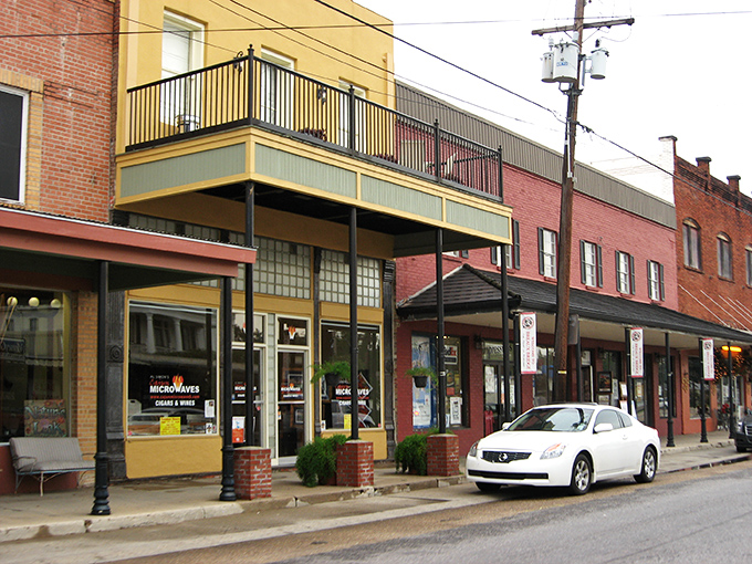 These historic storefronts aren't just buildings; they're time machines with balconies perfect for people-watching and second-guessing your life choices.