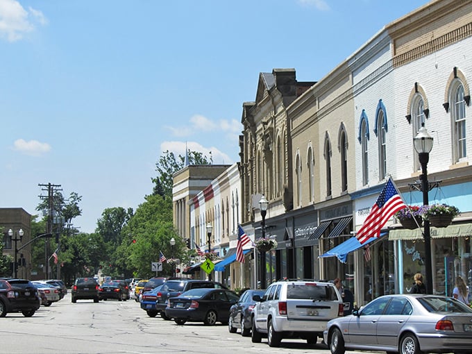 American flags flutter above storefronts that look like they've been waiting decades for your arrival. This isn't manufactured charm—it's the real deal.