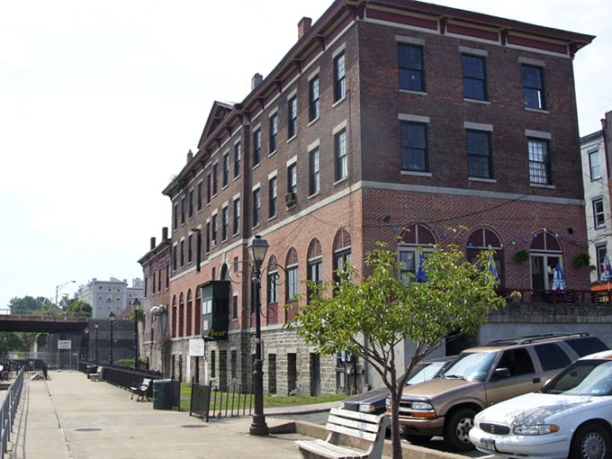 Brick buildings with character to spare line Oswego's waterfront district, where history isn't just preserved—it's still doing business daily.