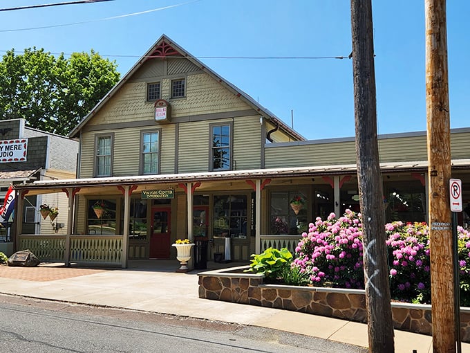 This isn't a movie set—it's the Eagles Mere Museum, where vibrant flowers welcome visitors to a slice of preserved Americana.