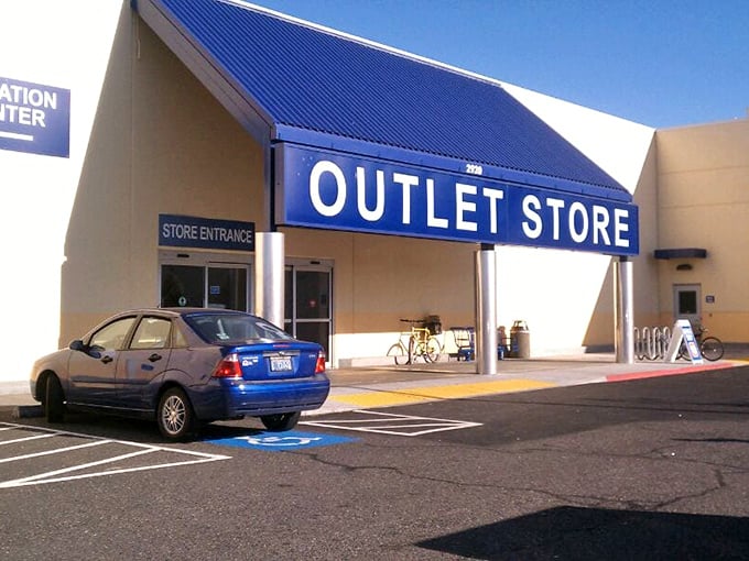 The entrance beckons with its bold blue awning, a portal to a parallel universe where $27 furnishes entire rooms.