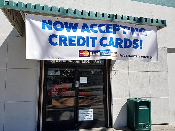 The modern era meets vintage shopping with that "NOW ACCEPTING CREDIT CARDS!" banner—your wallet's permission slip for guilt-free treasure hunting.