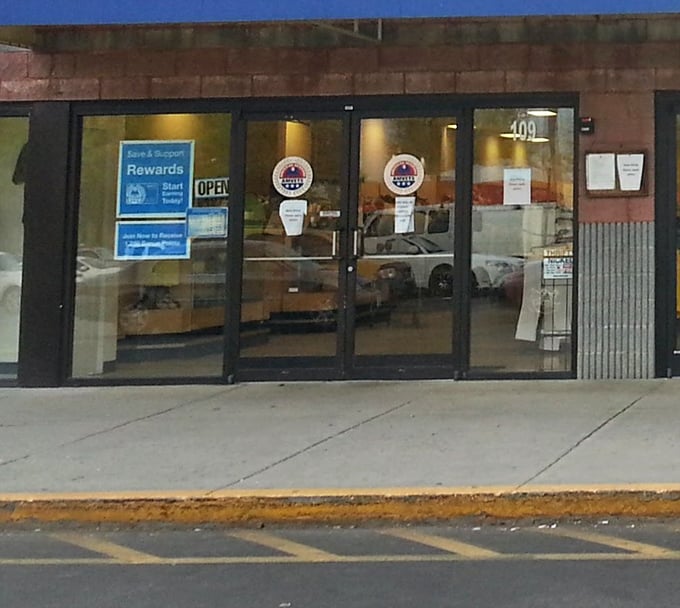 Step through these doors and kiss your afternoon goodbye. The rewards program sign is just a formality—the real reward is what you'll discover inside.