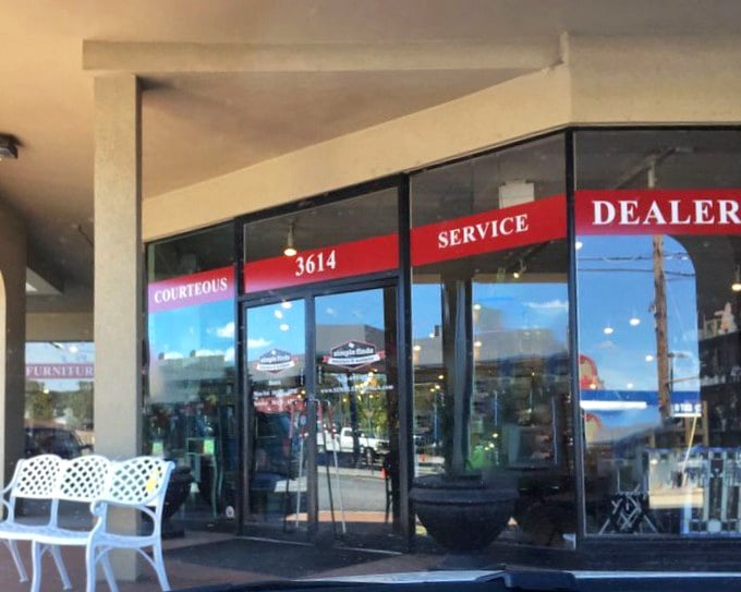 The entrance promises "COURTEOUS SERVICE" in bold red letters – the retail equivalent of a warm Georgia welcome without the humidity.