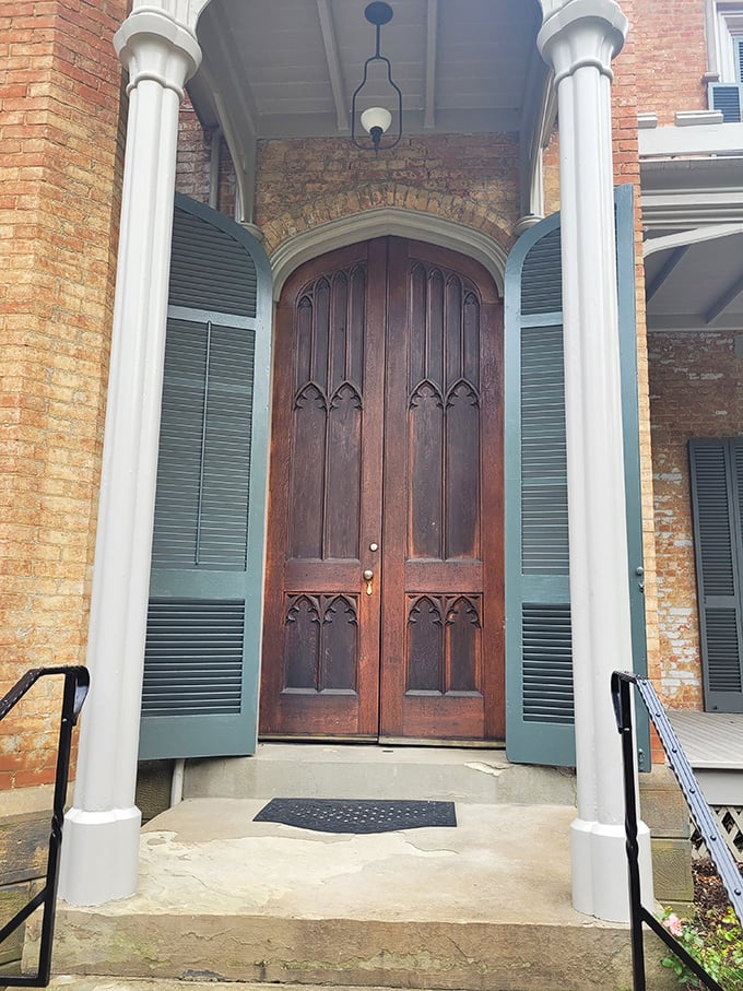 These aren't just doors—they're time portals to the 1850s. The Gothic arches and hefty woodwork scream "important people lived here" in the most charming way.