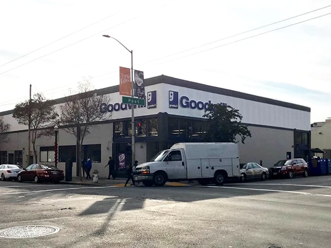 Goodwill's iconic blue signage stands out against the urban landscape, a beacon for budget-conscious shoppers and sustainability advocates alike.