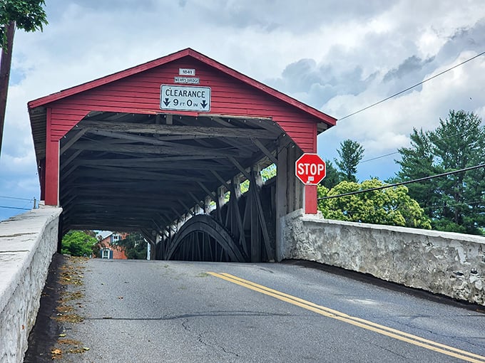 That 9-foot clearance sign isn't kidding around! Modern SUVs beware—this 19th-century marvel was built when transportation had fewer cup holders.