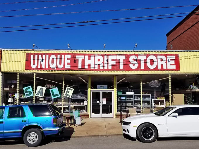 Blue skies frame the cheerful storefront where treasure hunters park their chariots before embarking on thrifting adventures.