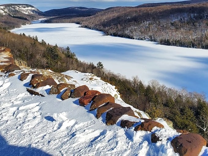 Winter's magic touch turns Lake of the Clouds into a serene snow globe scene. The silence here is so complete you can almost hear your thoughts echoing.