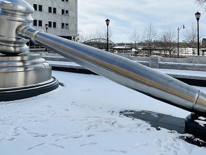 Winter transforms the World's Largest Gavel into a surreal sight. Snow dusts the massive sculpture, creating a "Law & Order: Special Winter Unit" vibe in the heart of Ohio's capital.