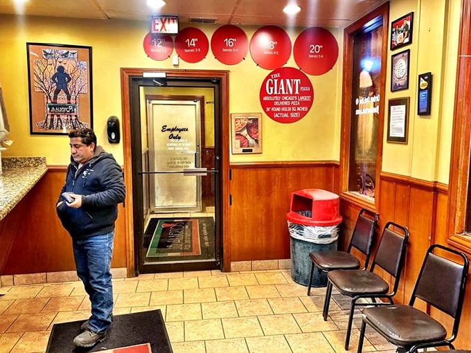 Inside, those red circles on the wall aren't just decoration—they're a pizza size chart that doubles as a challenge to your appetite.
