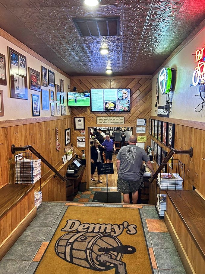 Walking down this wood-paneled entrance hallway feels like entering a temple dedicated to the worship of oversized burgers and cold beer.