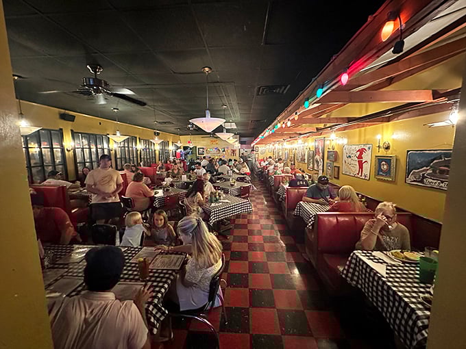 Red vinyl booths, checkered tablecloths, and string lights create that perfect "everybody knows your name" atmosphere where calories simply don't count.