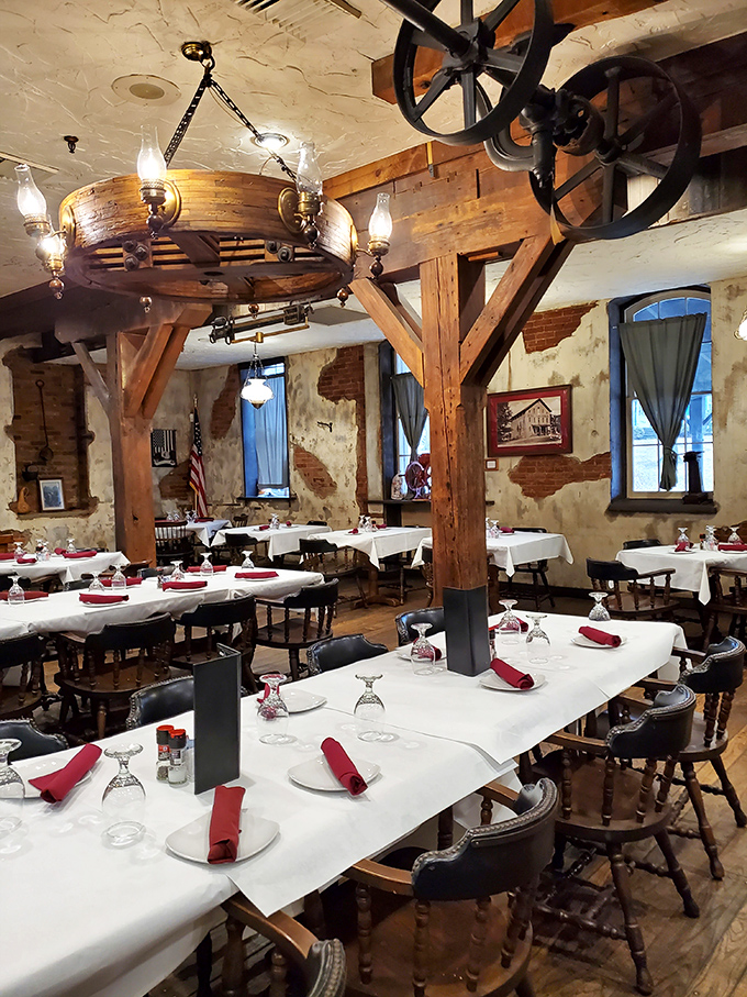 Dining among history—massive wooden beams and original mill wheels create an atmosphere where every meal feels like a special occasion.