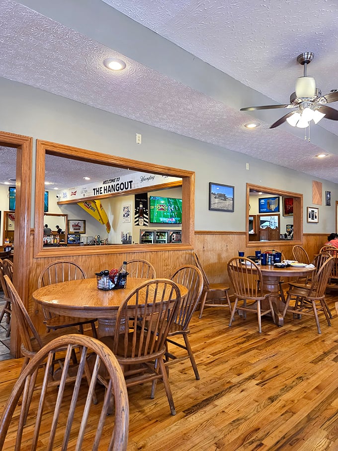 Warm wood paneling and Windsor chairs create that "grandma's dining room" vibe, minus the plastic-covered furniture and awkward family conversations.