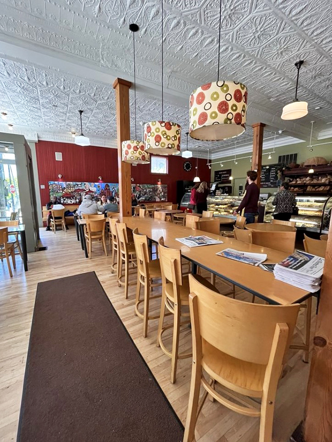 Ornate tin ceilings, warm wooden tables, and colorful pendant lights create that perfect "nonna's kitchen meets modern café" vibe that makes you want to linger all afternoon.