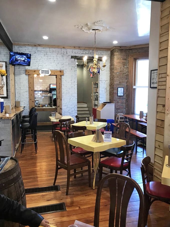 Inside, exposed brick walls and wooden floors create the perfect backdrop for the smoky magic that's about to happen on your plate.
