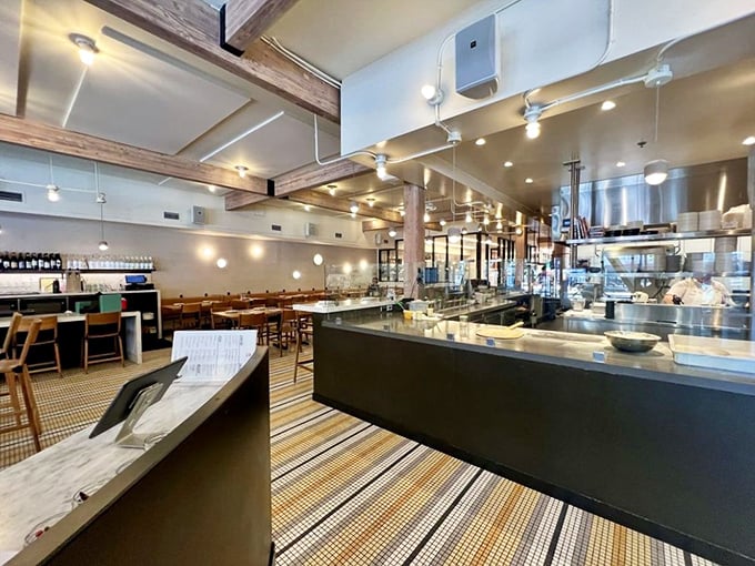 The open kitchen design lets you witness pizza magic in real-time, because great food should never hide behind walls.