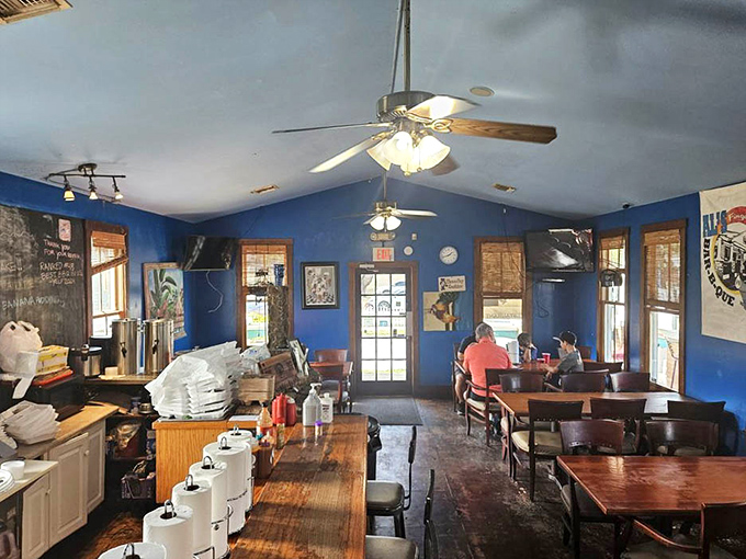 Inside, those vibrant blue walls aren't just a design choice—they're the perfect backdrop for the serious business of barbecue appreciation that happens daily.