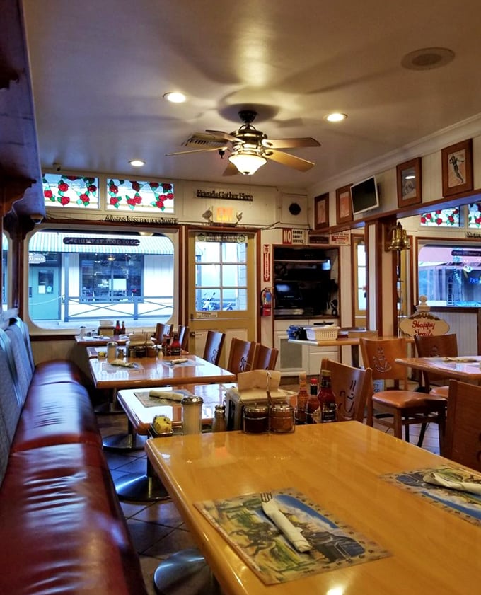 Warm wood, cozy booths, and stained glass windows create that perfect diner ambiance—like stepping into your favorite aunt's kitchen, if your aunt lived on an island paradise.