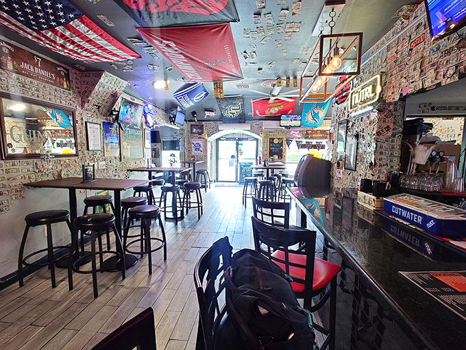 Step inside and you're greeted by brick walls plastered with memories, flags hanging overhead like a United Nations of good times.