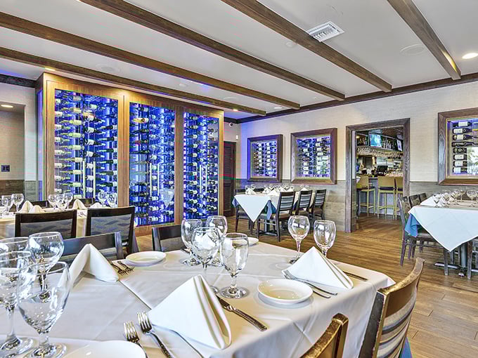 Elegant yet unpretentious, the dining room's blue-lit wine display creates an atmosphere where you can wear flip-flops or formal shoes and still feel perfectly at home.
