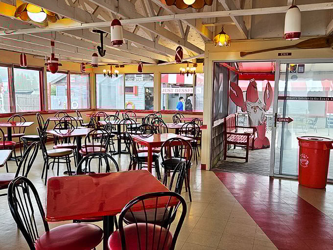 Nautical simplicity at its finest—red tables, buoy lights, and a dining room where the only white tablecloth you'll find is the napkin on your lap.