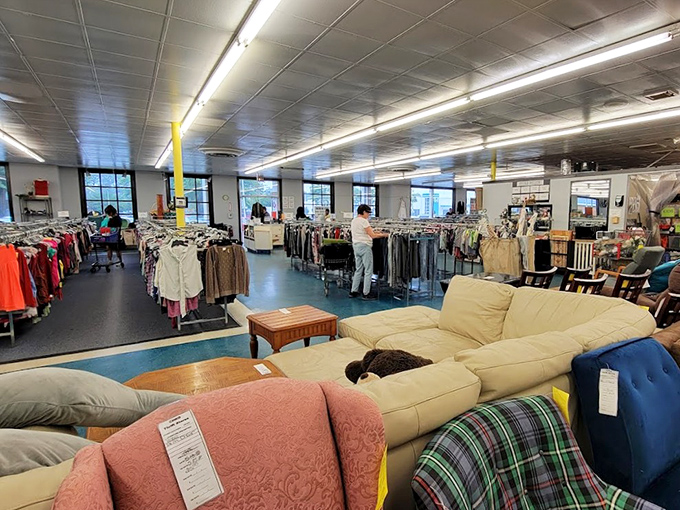 The thrifter's paradise unfolds with endless racks of clothing on one side and a furniture showroom that would make any apartment-hunter swoon.