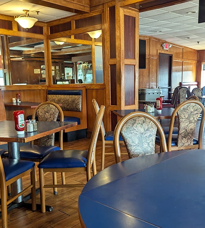 Warm wooden booths with patterned upholstery create the perfect setting for everything from first dates to existential 3 AM conversations.