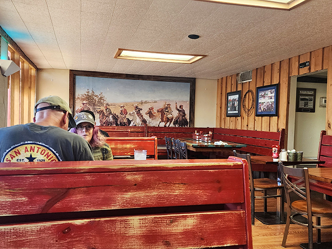 Wood paneling and Western art create the kind of timeless diner atmosphere that Instagram could never replicate properly.