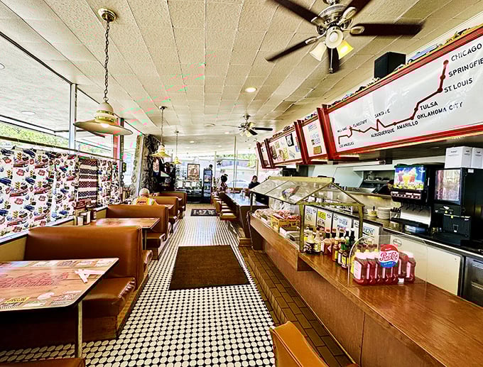 Step inside and time-travel to the 1950s – classic checkered floors, vintage Route 66 maps, and cozy booths create the perfect backdrop for American diner magic.