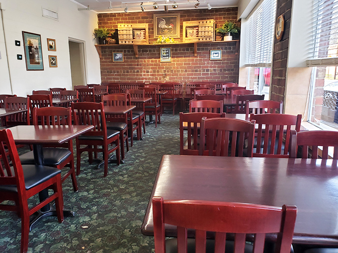 Cherry-red chairs and wooden tables create a no-nonsense dining room where the focus remains squarely on what matters most—that glorious fried chicken.