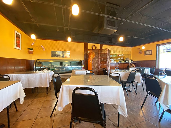 Warm yellow walls and white tablecloths create that perfect "Goldilocks zone" of dining – not too fancy, not too casual, just right.