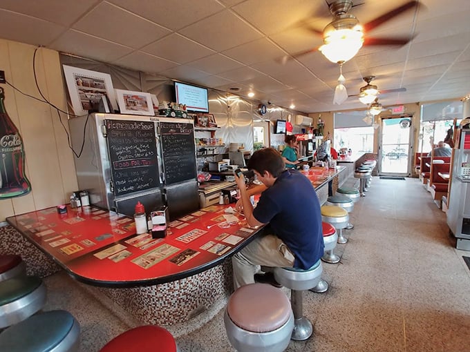 Counter culture at its finest—where regulars perch on swivel stools, solving the world's problems one coffee refill at a time.