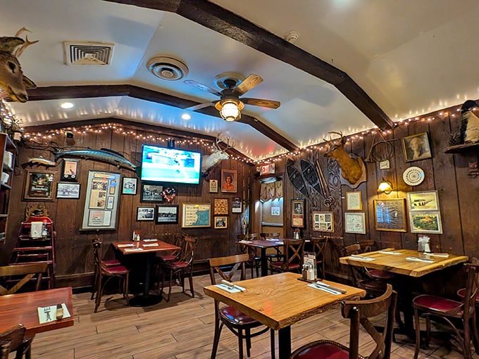 Step inside and time stands still – wood paneling, trophy mounts, and twinkling lights create the steakhouse equivalent of a warm embrace.