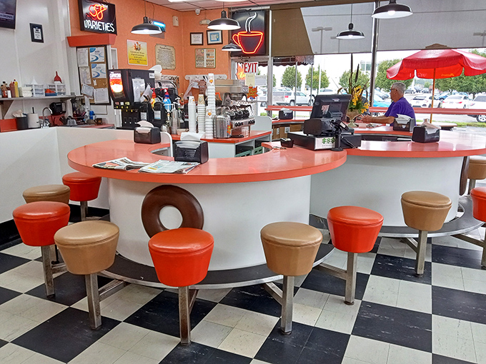 Those donut-shaped stools aren't just cute—they're strategic. Sit on one, and you're practically obligated to order a dozen.