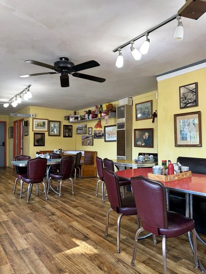 Yellow walls adorned with memories and burgundy vinyl chairs – the classic diner formula that never fails to comfort the soul.